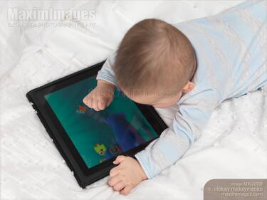 Photo of Baby Boy Playing with iPad | Stock Image MXI22938