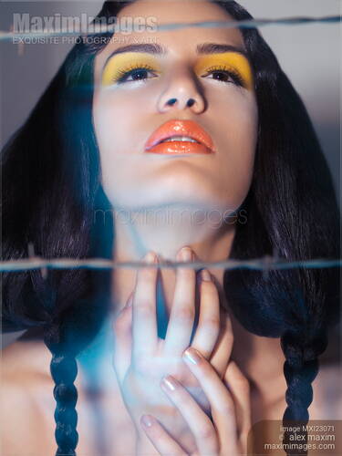 Photo of Beauty Portrait of a Woman Behind Barbed Wire | Stock Image ...