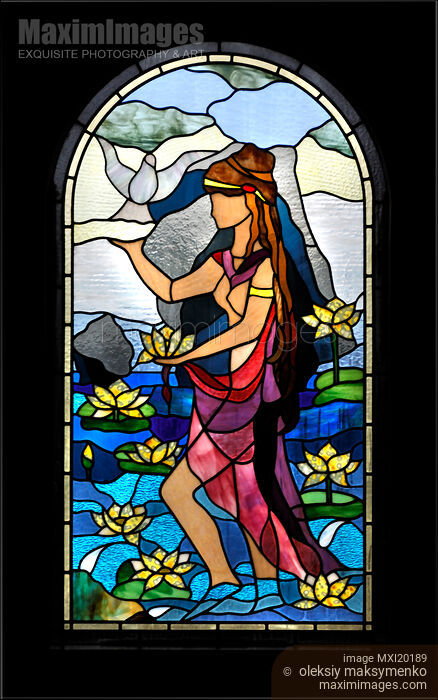 Photo of Colorful Stained Glass Window Greek ornament of woman | Stock ...