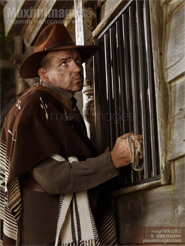 Photo of Cowboy Attempting to Rob a Bank Wild west bank robber | Stock ...