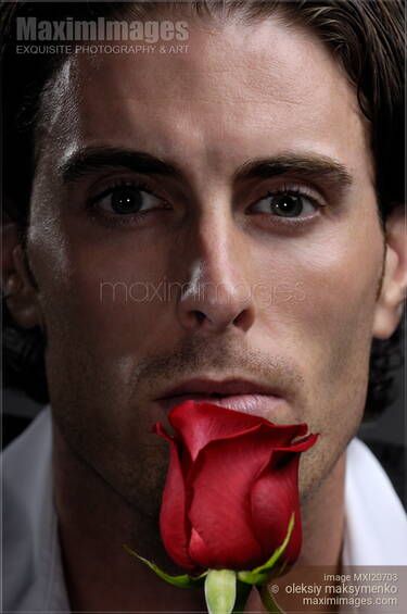 Photo of Fasce of a Man with a Red Rose | Stock Image MXI20703