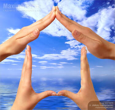 Photo of Hands making house symbol over blue sky background | Stock ...