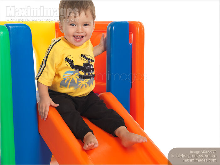 Photo of Happy Child on a Slide | Stock Image MXI22770