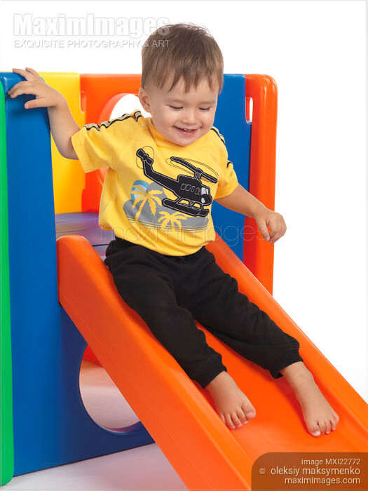 Photo of Happy Child on a Slide | Stock Image MXI22772