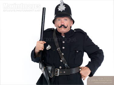 Photo of Humorous portrait of Keystone Cop with baton | Stock Image ...