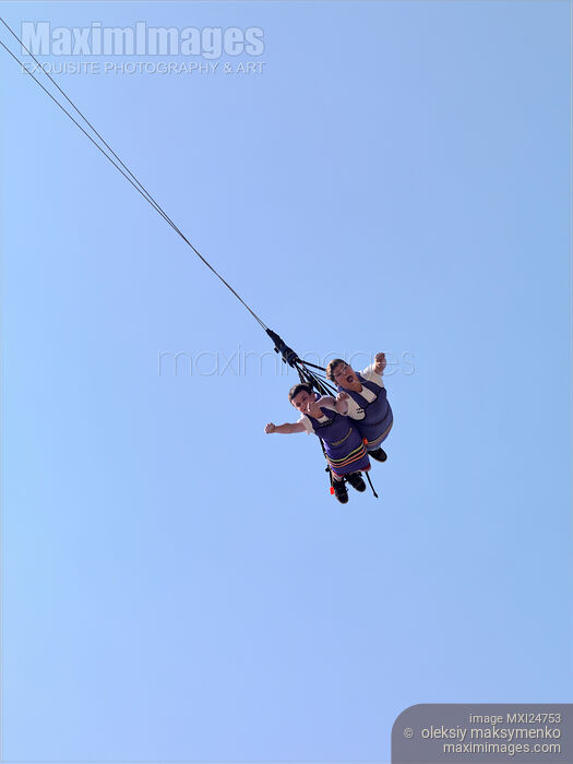 Photo of People Enjoying Free-Fall Swing | Stock Image MXI24753