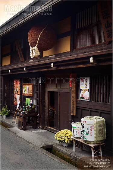 Photo of Sugidama cedar ball hanging above the entrance of a sake ...