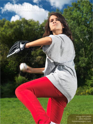 Photo of Teenage girl throwing baseball | Stock Image MXI24689