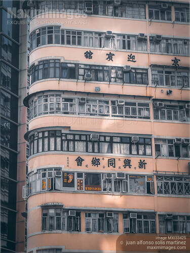 Photo of Wall of an urban residential high-rise building with balconies ...