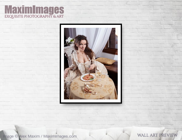 Art Print of Beautiful elegant lady in vintage carnival dress eating ...