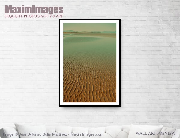 Art Print of Intricate wave patterns on the sea beach sand in low tide ...