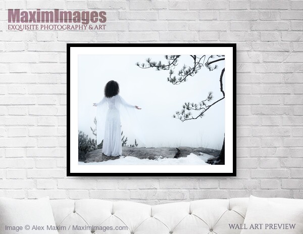 Art Print of Woman standing on a cliff with spread hands embracing the ...